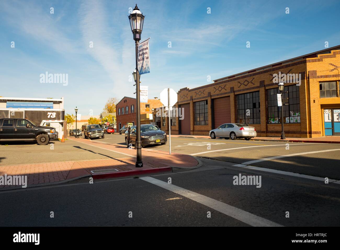 Cars drive down a street in downtown Martinez, California, December 3 ...