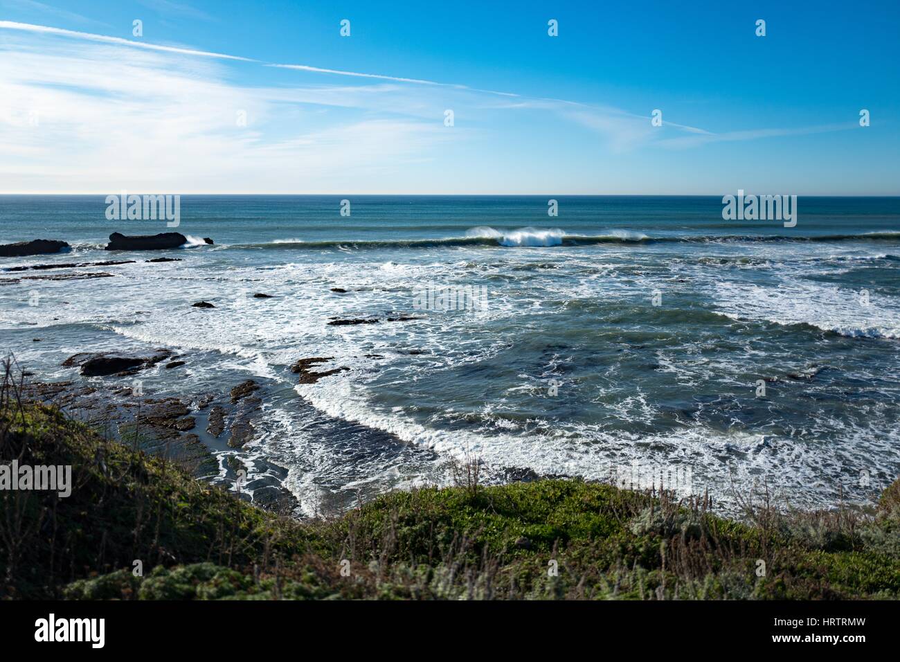 Waves break along a rock shore in Half Moon Bay, California, December ...