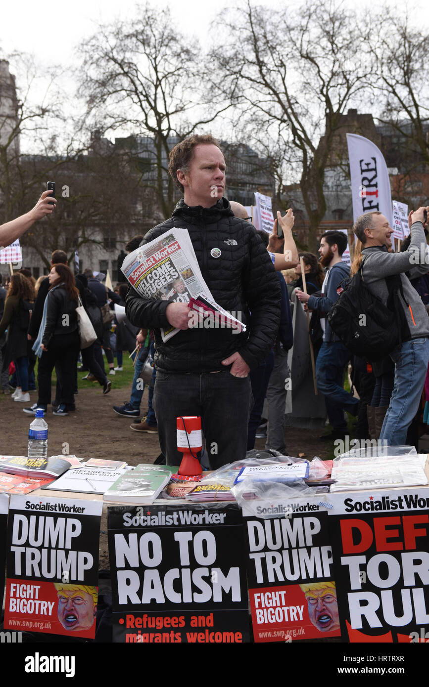 Socialist Worker stall filled up with placards and leaflets during the ...