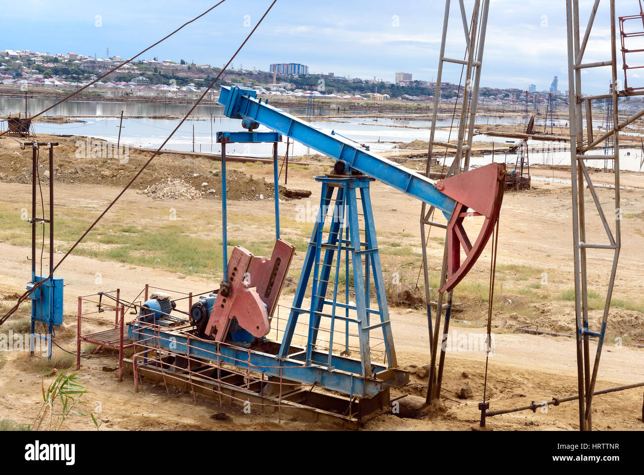 Oil derrick on oil field in village near Baku. Azerbaijan Stock Photo ...