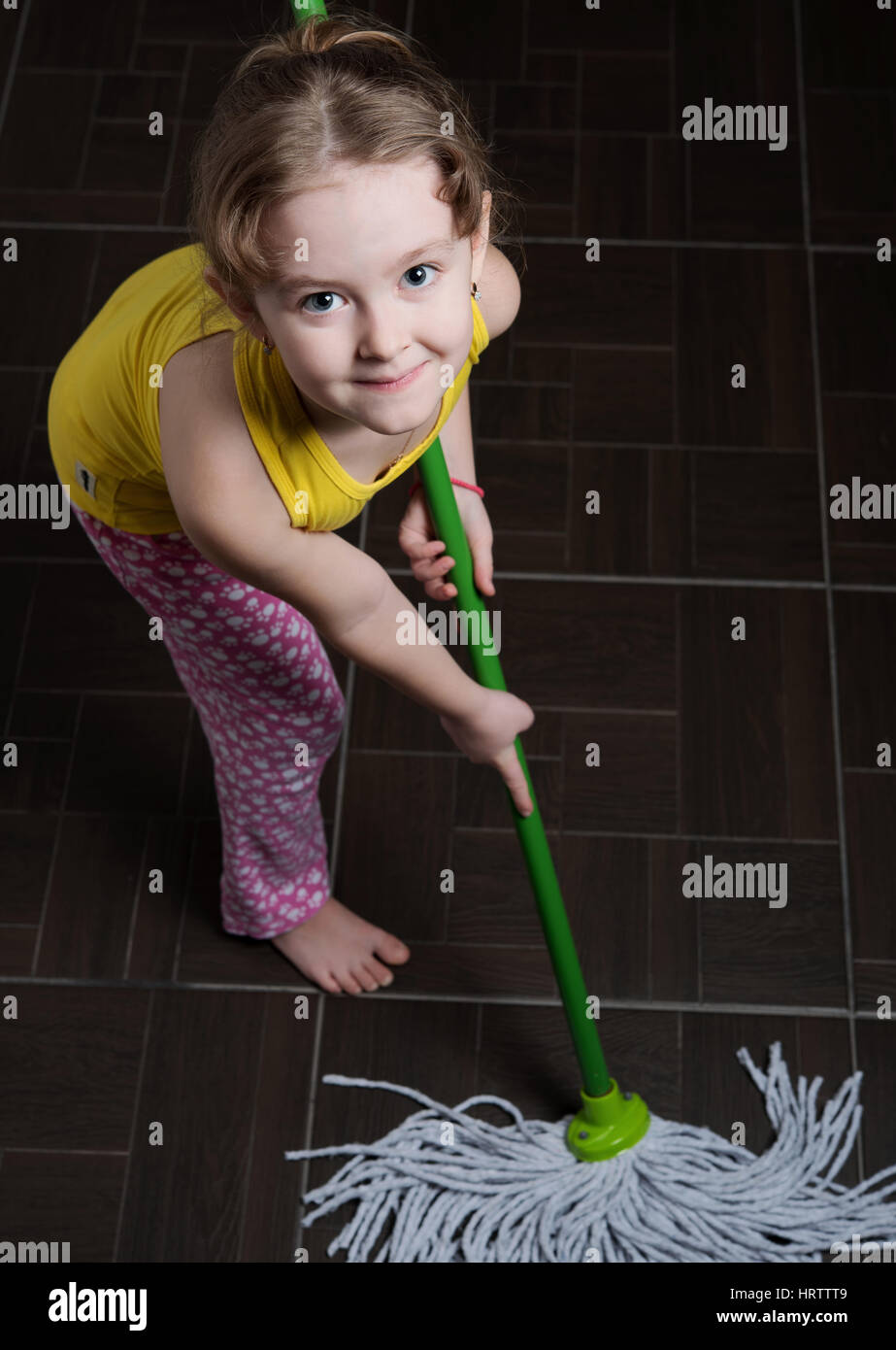 nice child washing the floor with MOP Stock Photo - Alamy