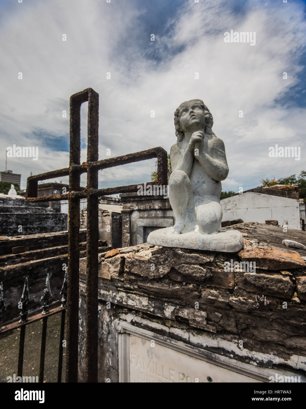 Praying Statue in New Orleans Cemetery Stock Photo - Alamy