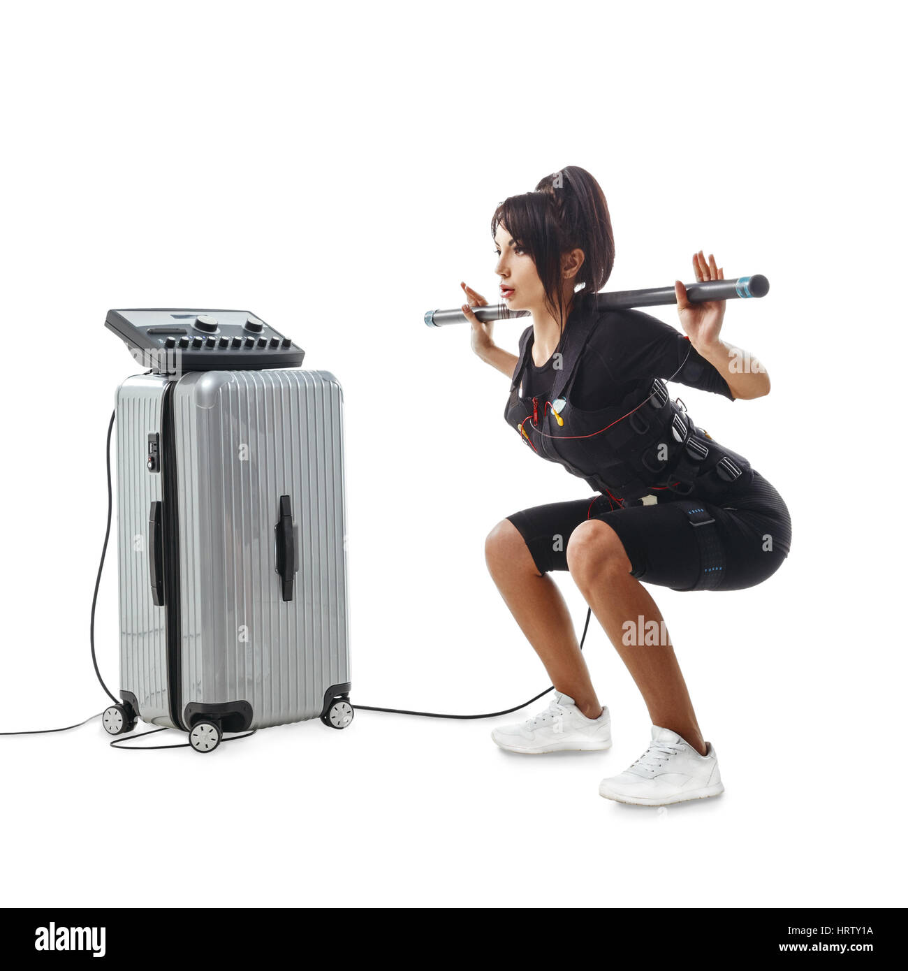 Electrical muscular stimulation fitness woman in full ems suit doing ...