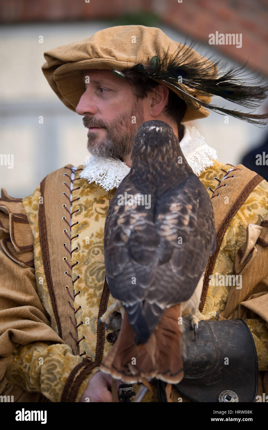 Falconry display at the medieval festival with various birds of prey in ...