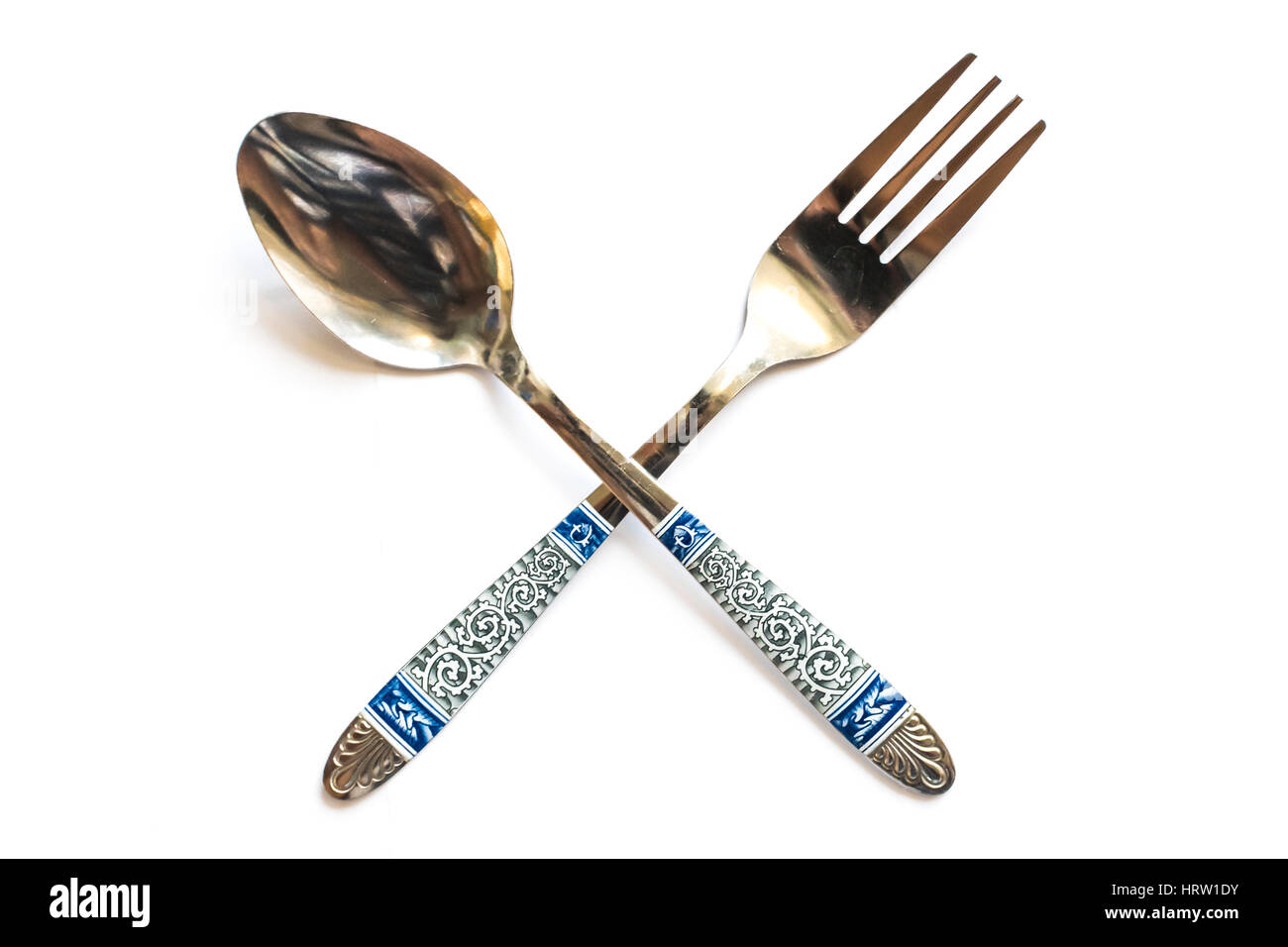 Spoon and fork are cross on white background Stock Photo - Alamy