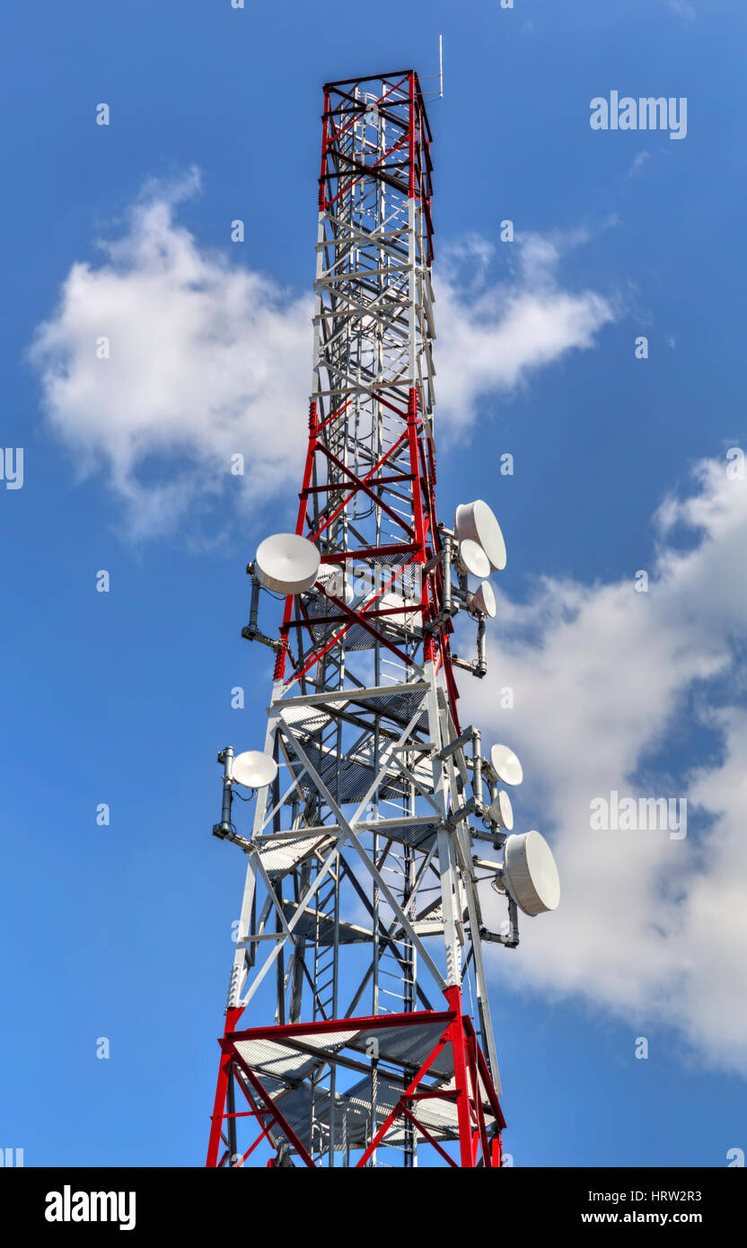 Communication antenna tower on blue sky Stock Photo - Alamy