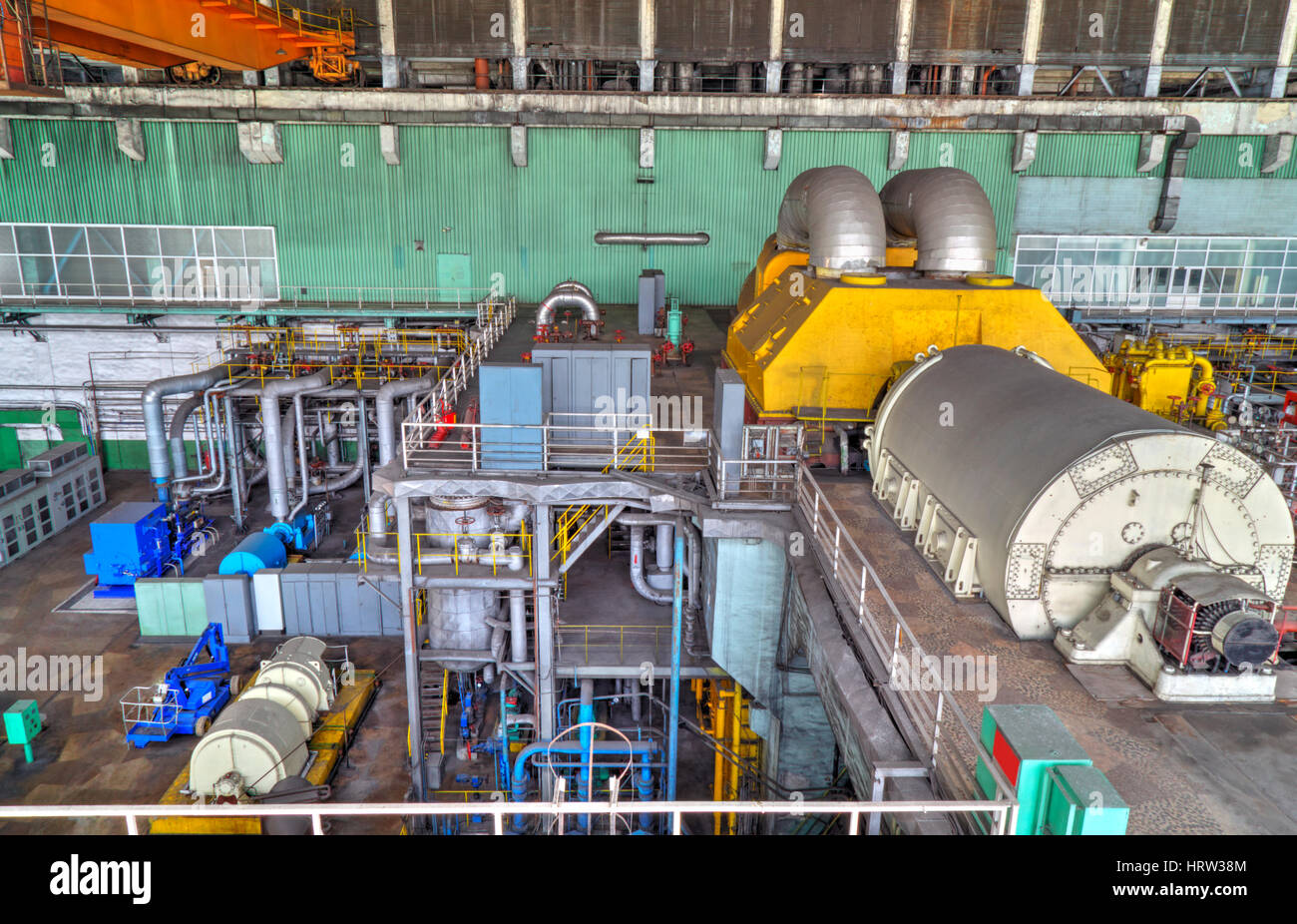 Machine room in thermal power plant with electric generators and ...