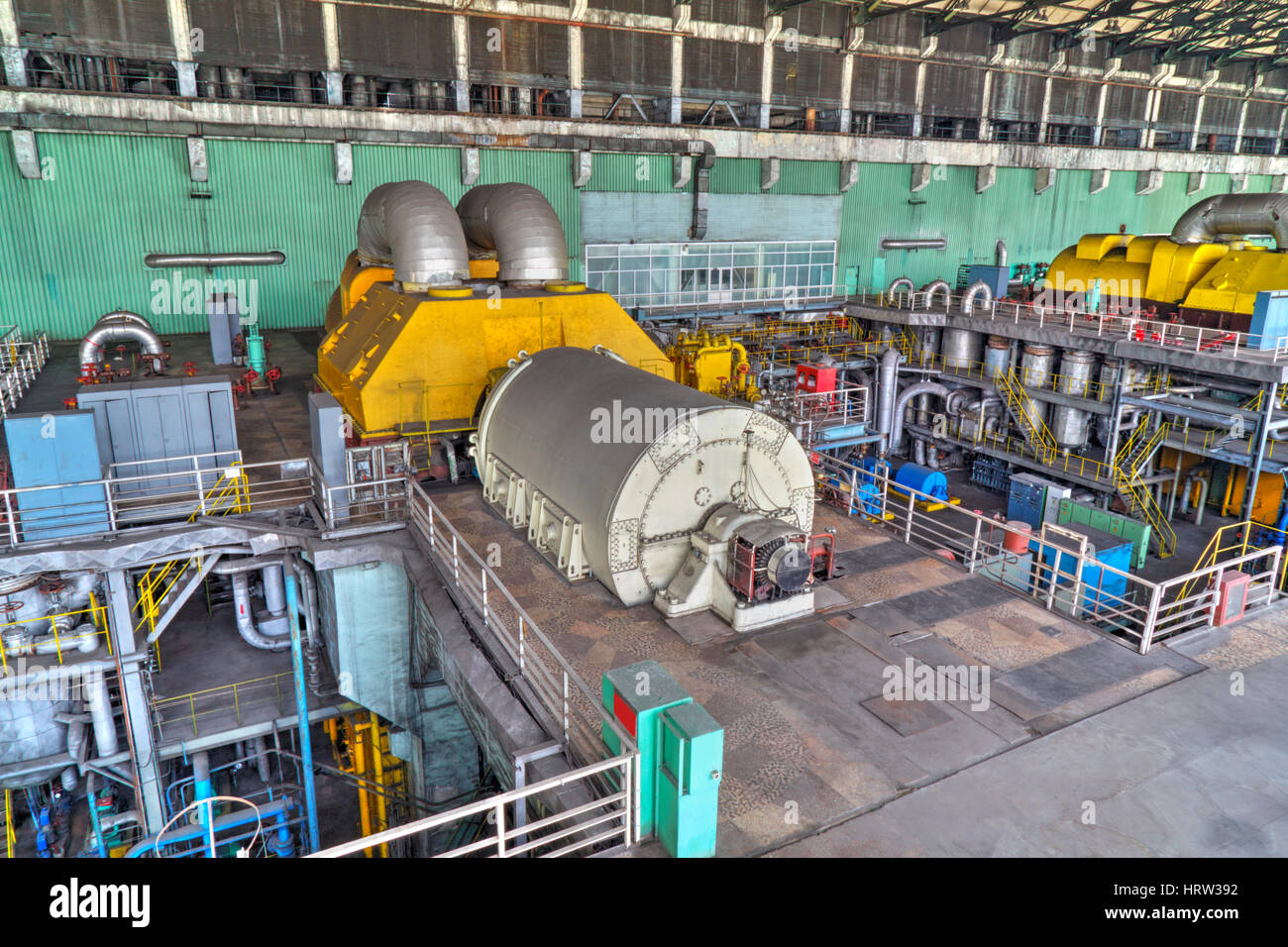Machine room in thermal power plant with electric generators and ...