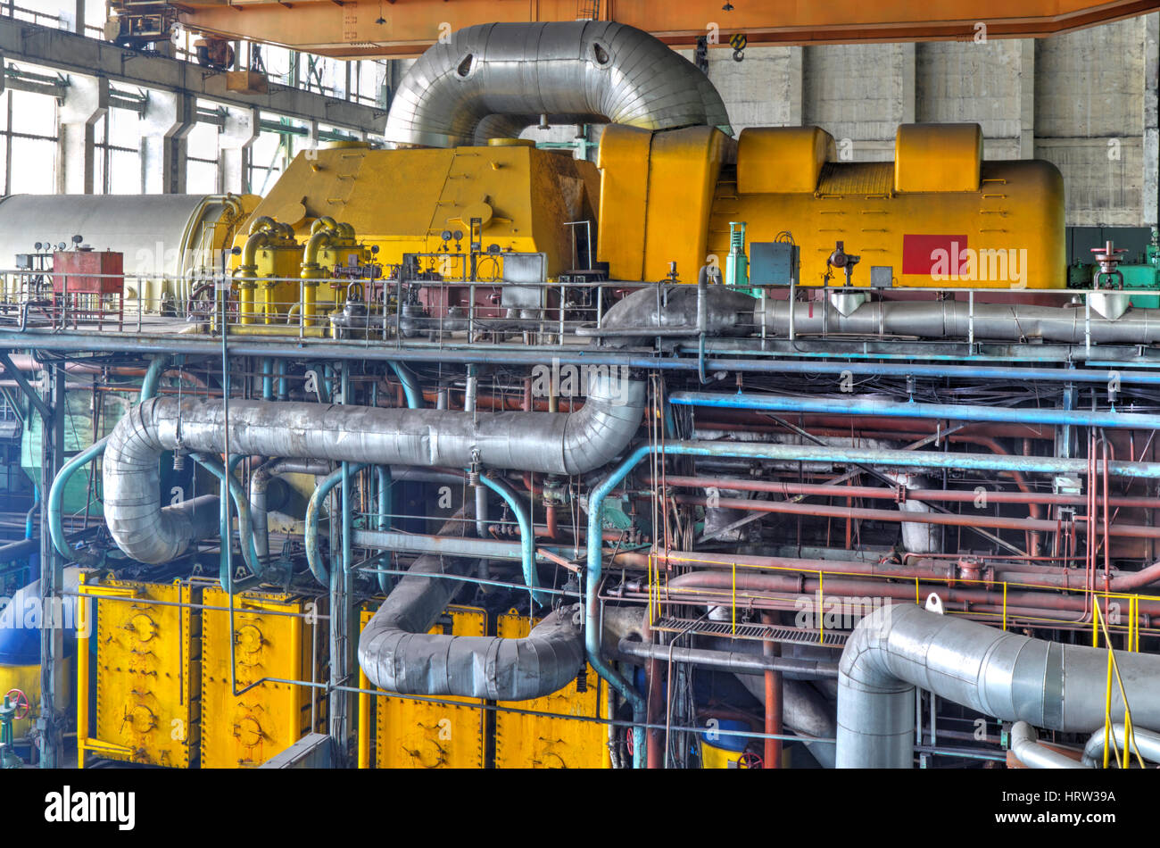 Machine room in thermal power plant with electric generators and ...