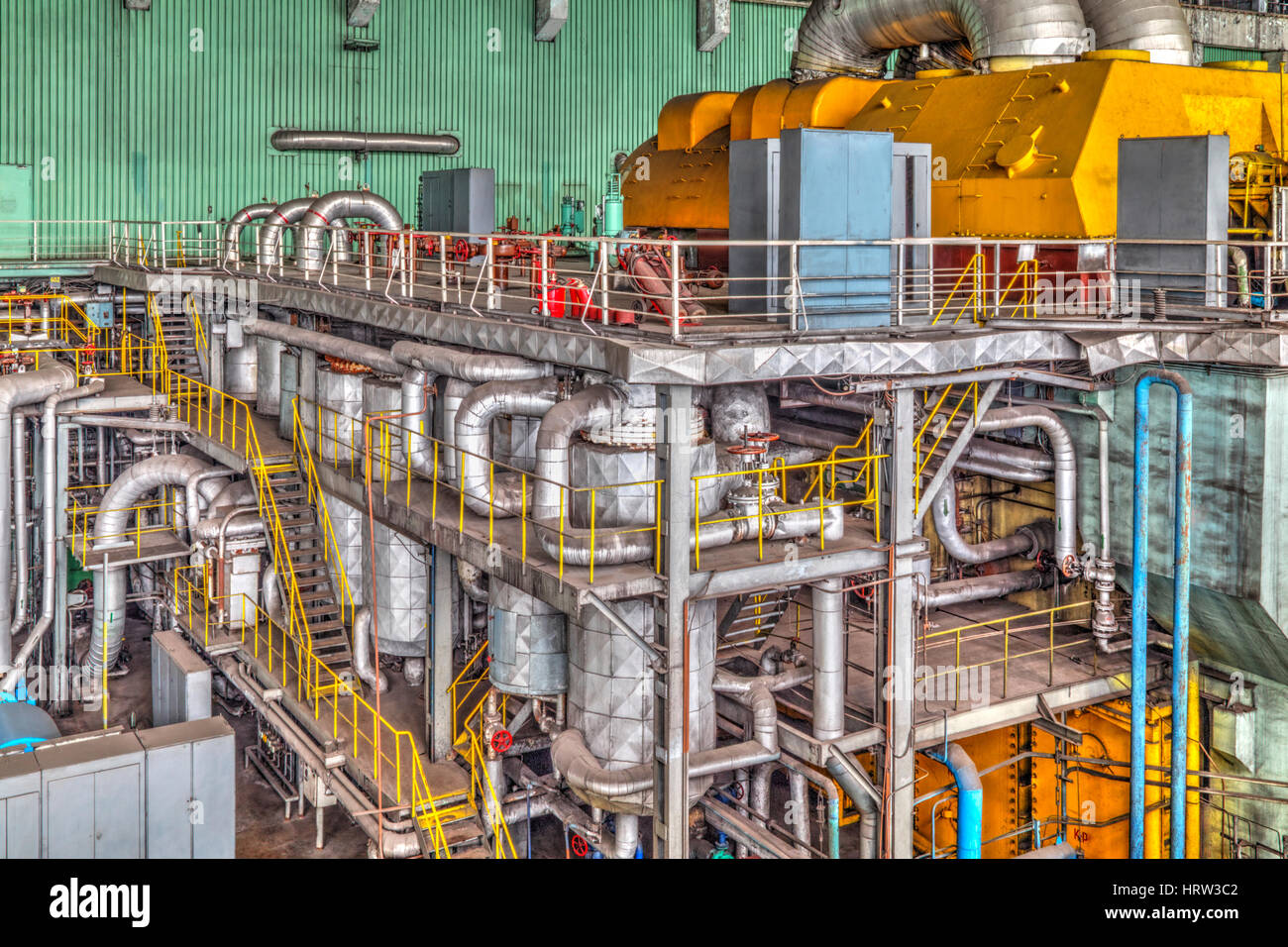 Machine room in thermal power plant with electric generators and ...