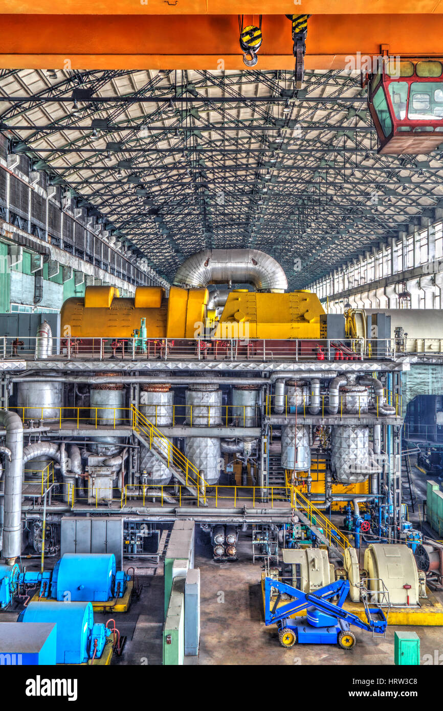 Machine room in thermal power plant with electric generators and ...