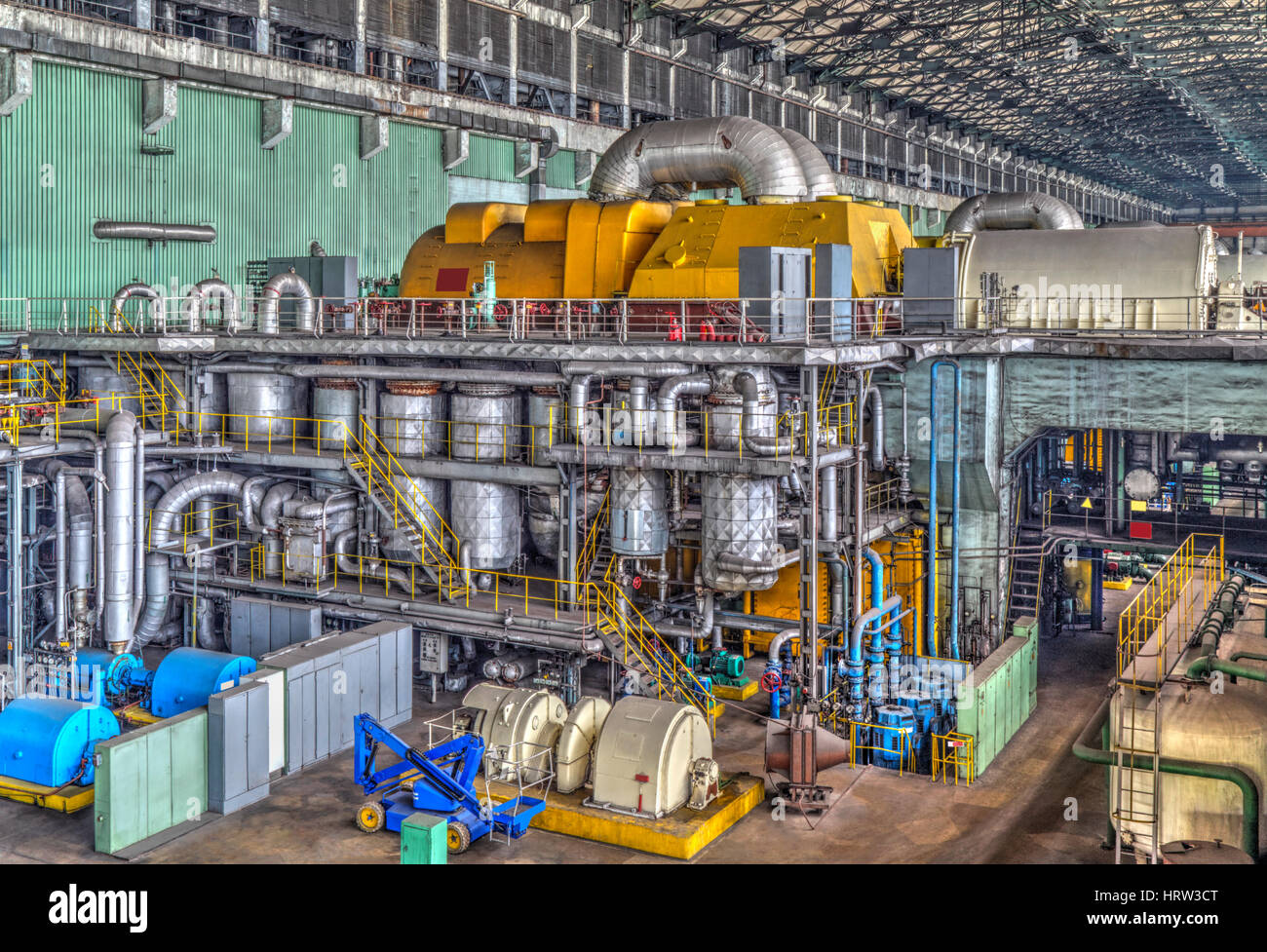 Machine room in thermal power plant with electric generators and ...