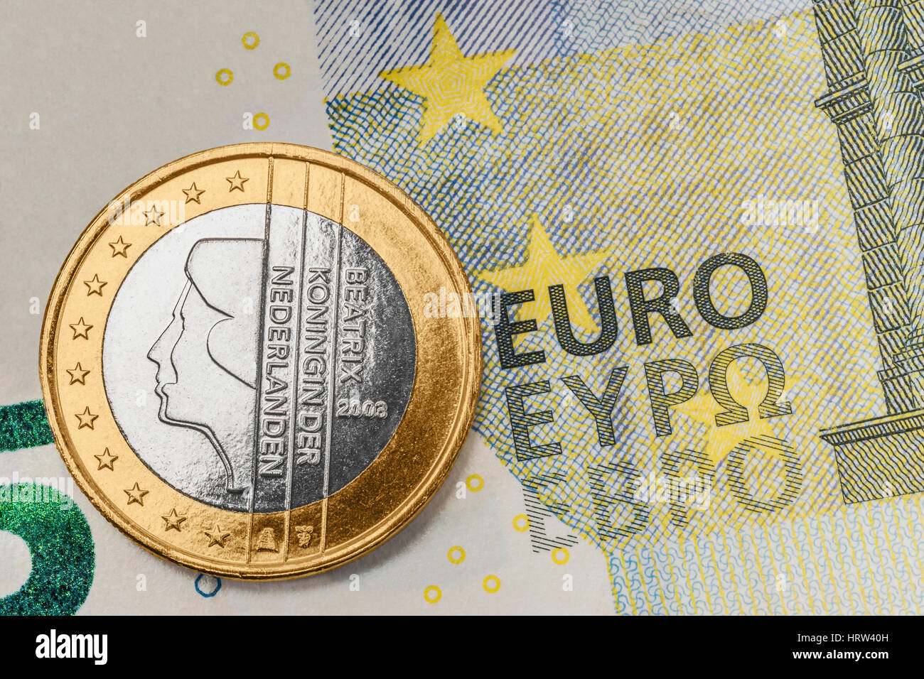 a 1 euro coin from the Netherlands on a 5 euro banknote Stock Photo - Alamy