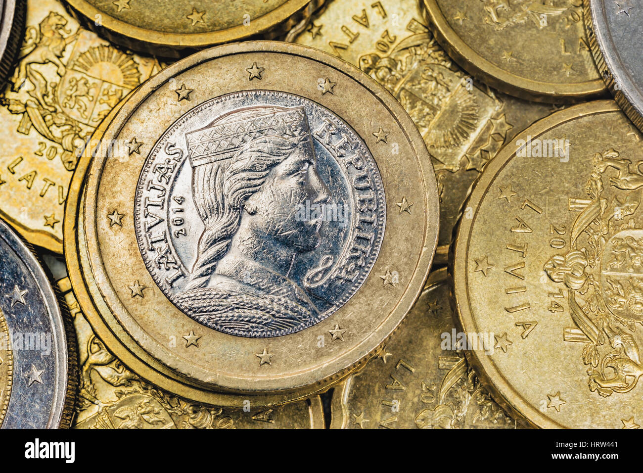 many euro coins from Latvia, on top is a 1 euro coin from Latvia Stock ...