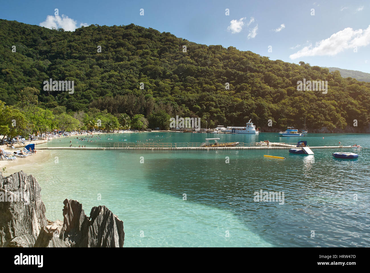 People spending time on beach doing activity in caribbean island ...