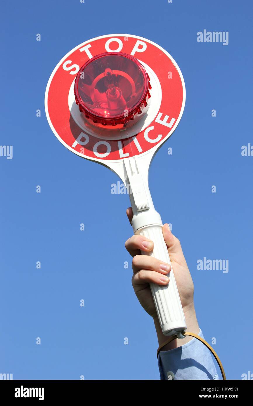 police signalling disc against blue sky Stock Photo - Alamy