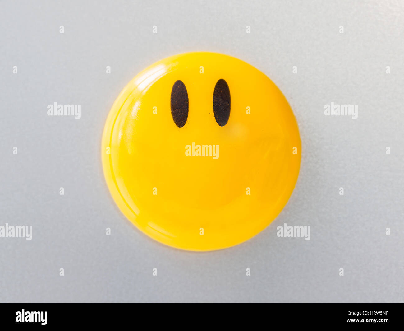 Yellow magnet on paper background, abstract background Stock Photo - Alamy