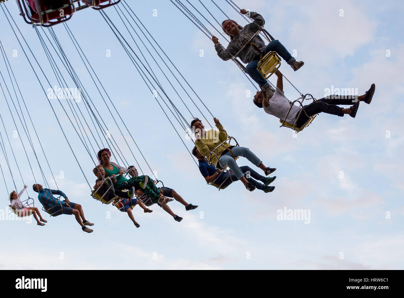 BARCELONA - SEP 5: People have fun at the carousel flying swing ride ...