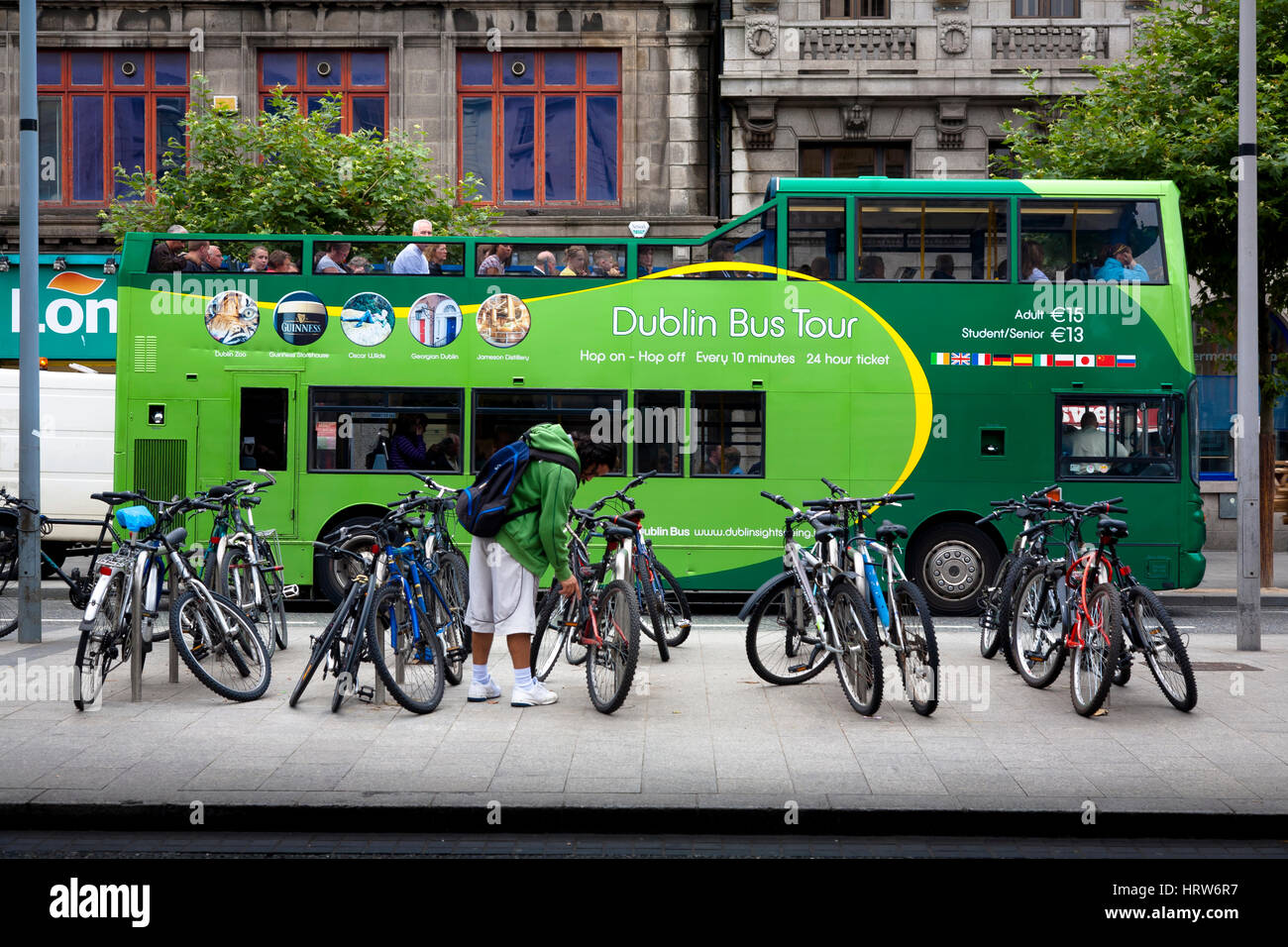 Street, bicycles and tourist bus Stock Photo - Alamy