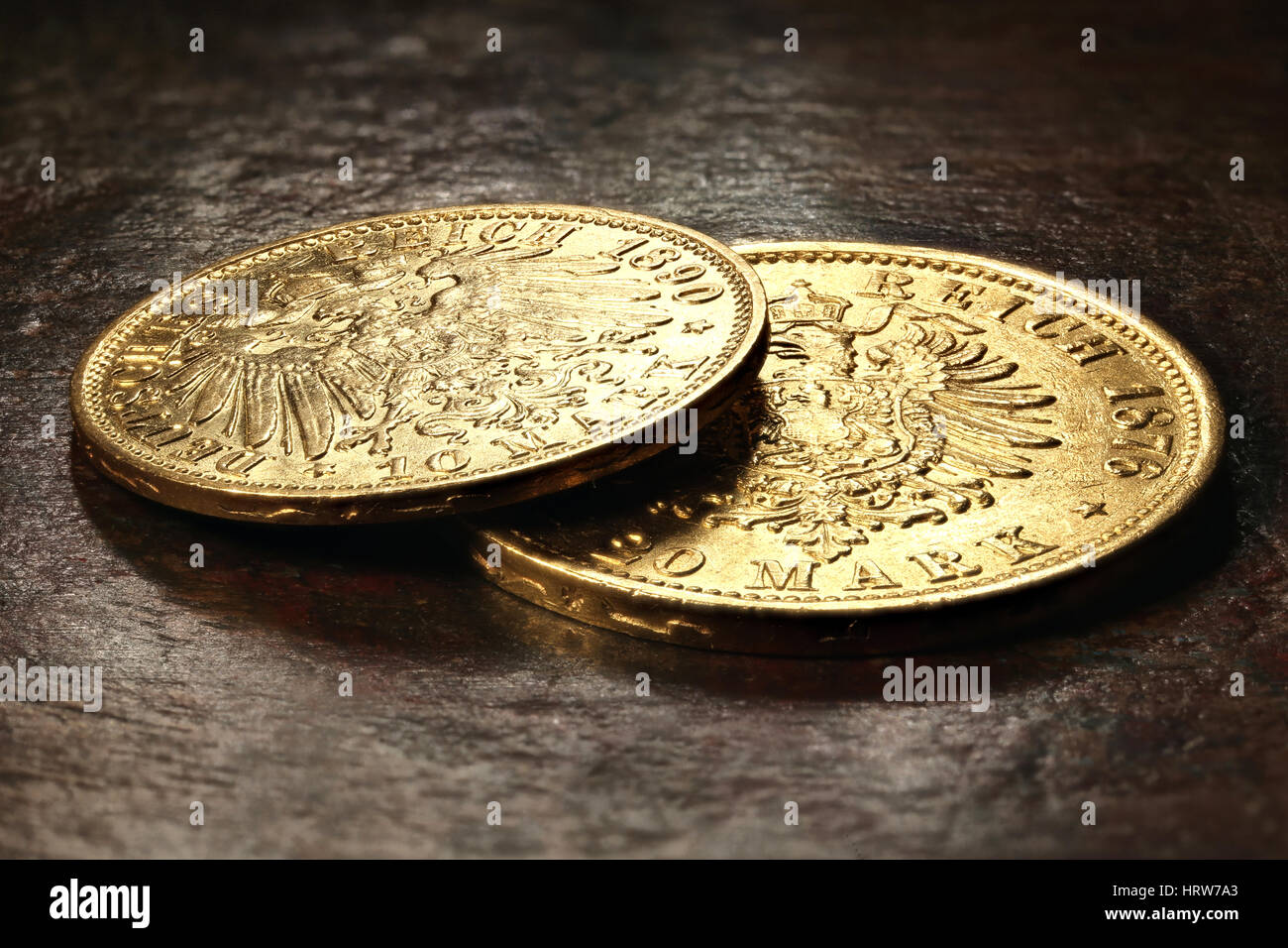 Hamburg gold coins (German Empire Goldmark) on rustic wooden background ...