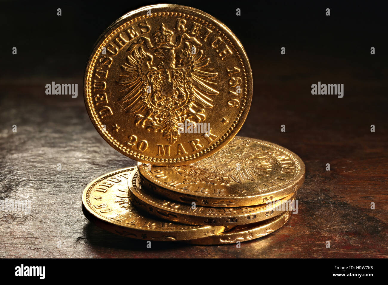 Hamburg gold coins (German Empire Goldmark) on rustic wooden background ...
