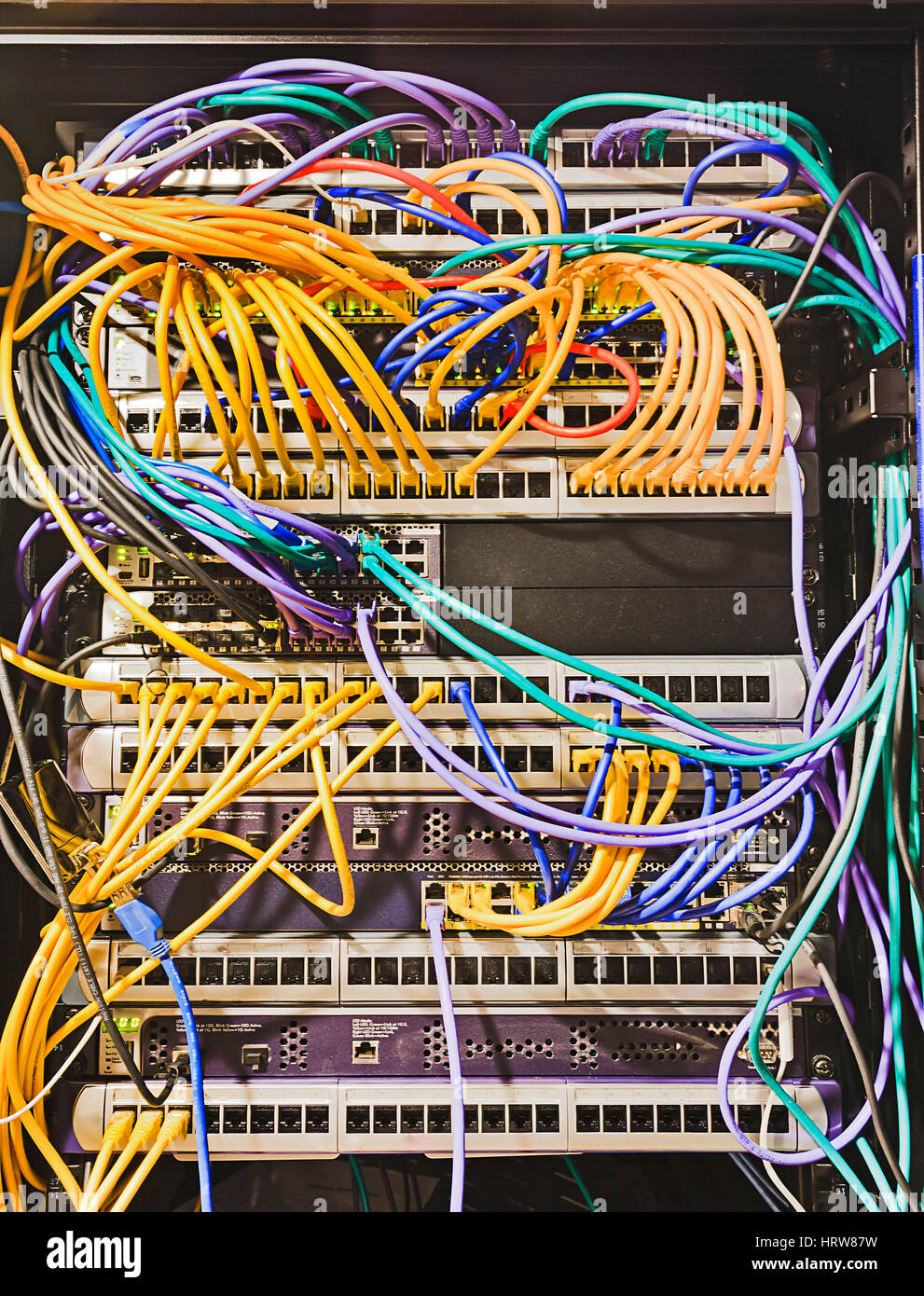 Computer data centre rack with patch panels and connected plugged patch ...