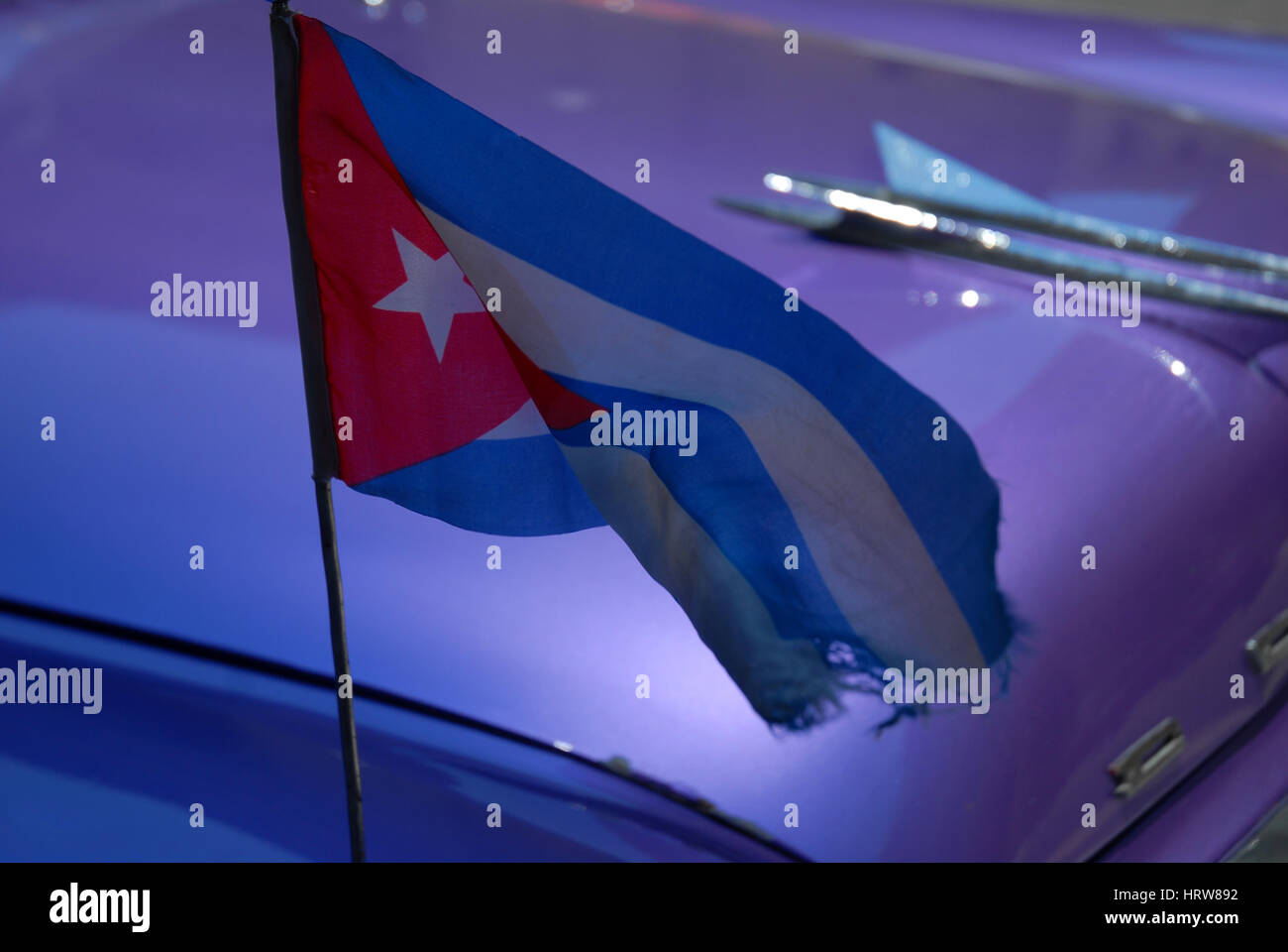 Bonnet of purple vintage car with Cuban Flag, Parque Central, Havana ...