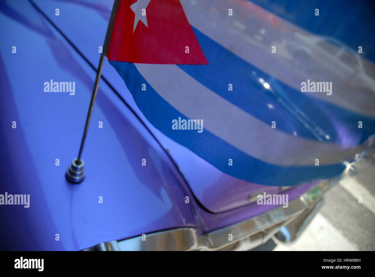 Bonnet of purple vintage car with Cuban Flag, Parque Central, Havana ...