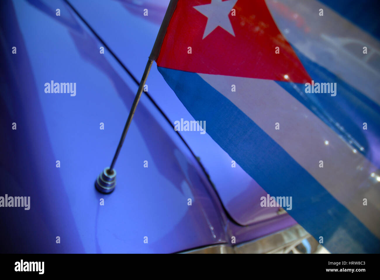 Bonnet of purple vintage car with Cuban Flag, Parque Central, Havana ...