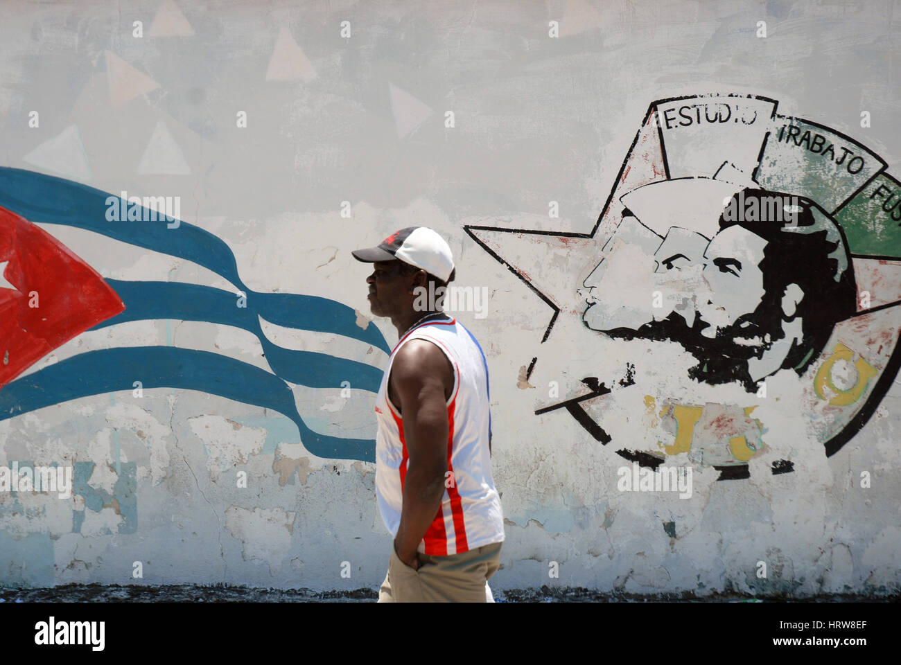 Man walking past mural of Cuban Flag, Havana, Cuba Stock Photo - Alamy