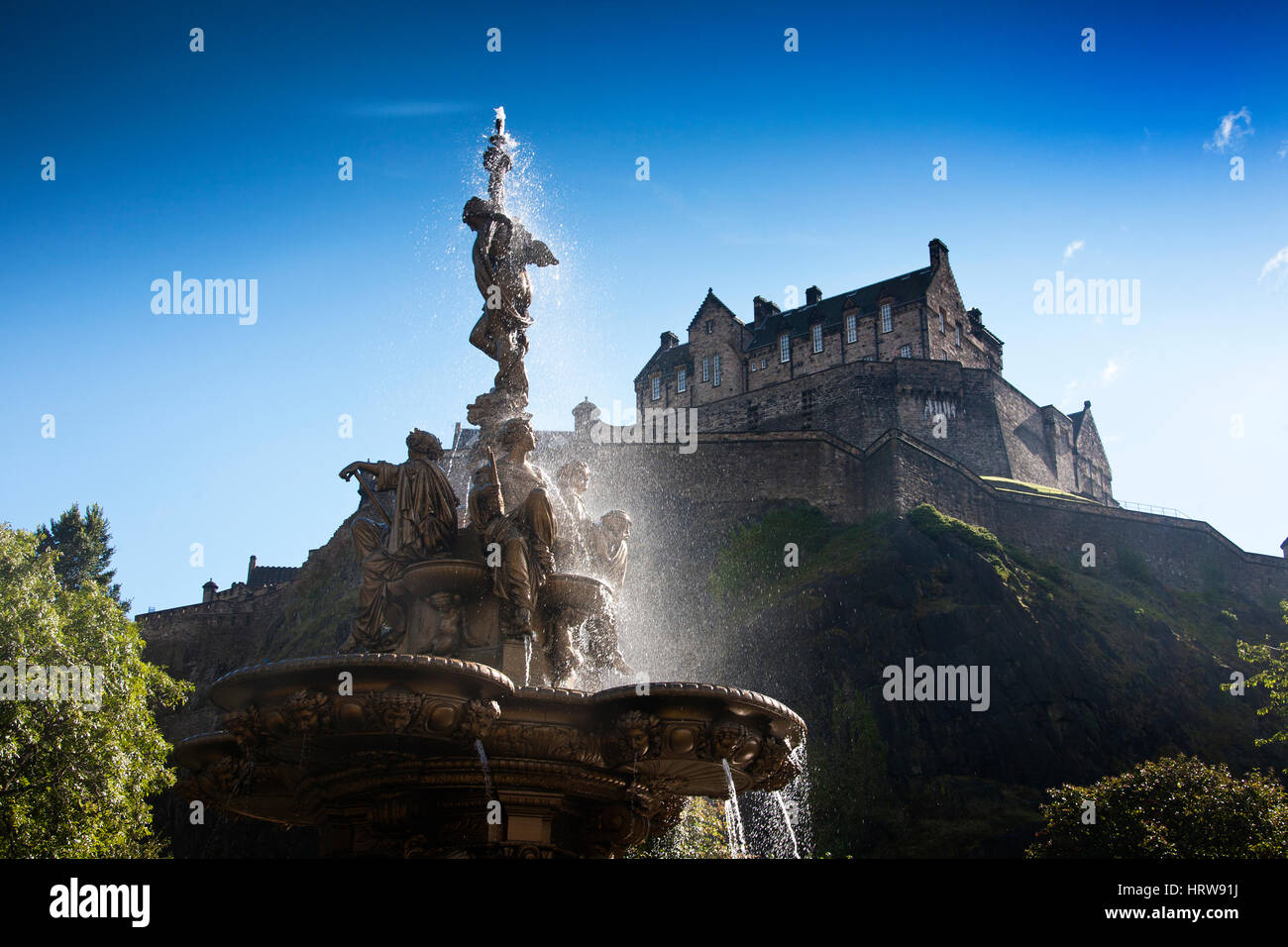 Edinburgh Castle with unlight through Ross Fountain Stock Photo - Alamy