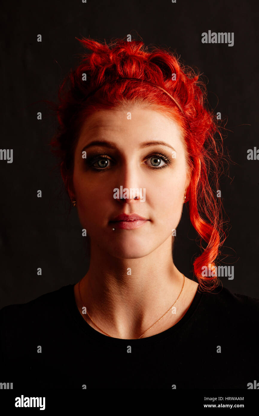 Portrait of a beautiful redhead woman staring into the camera Stock ...