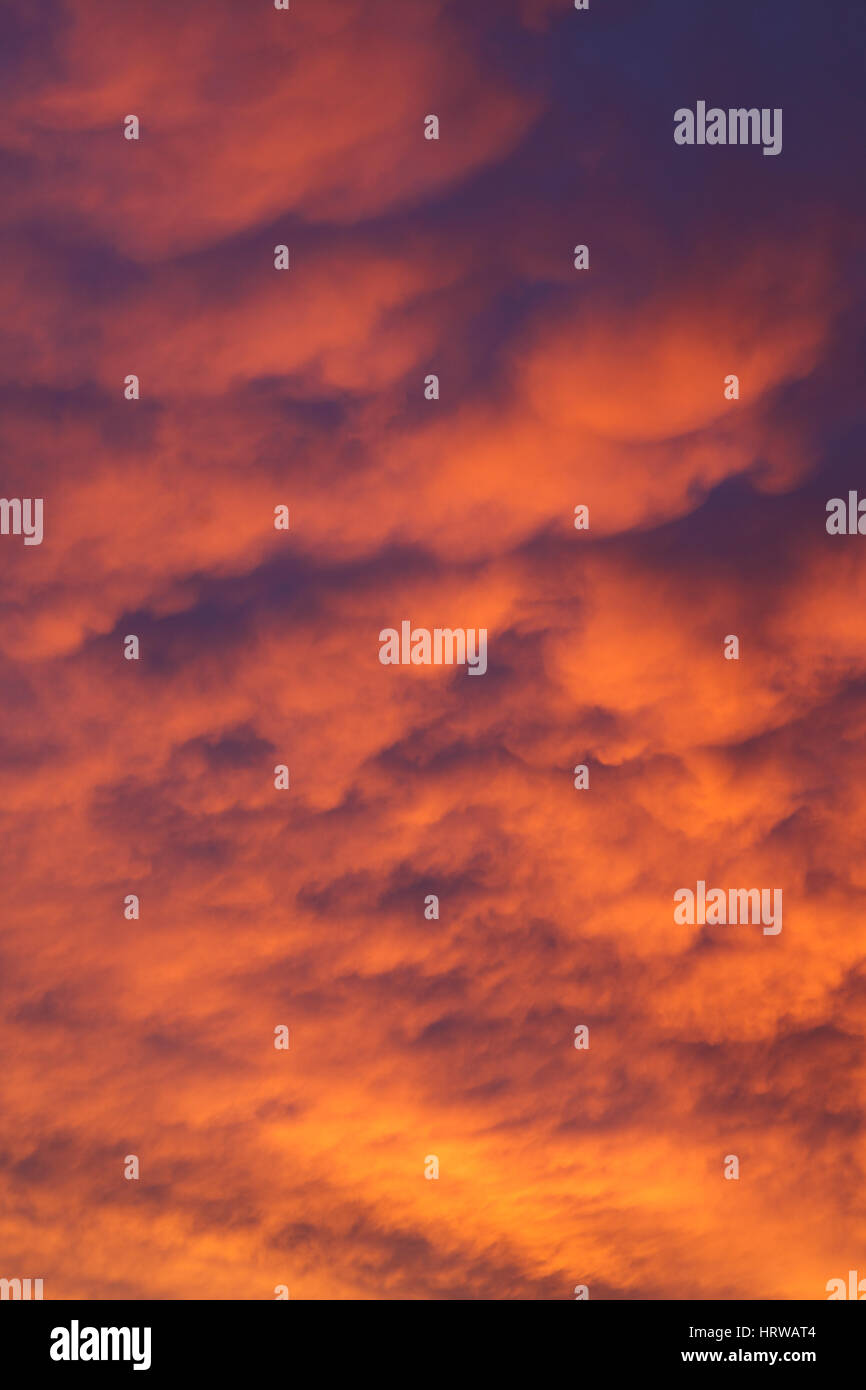 Fiery vivid sunset sky clouds scape background Stock Photo - Alamy