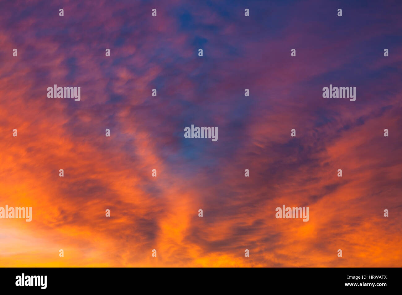Fiery vivid sunset sky clouds scape background Stock Photo - Alamy