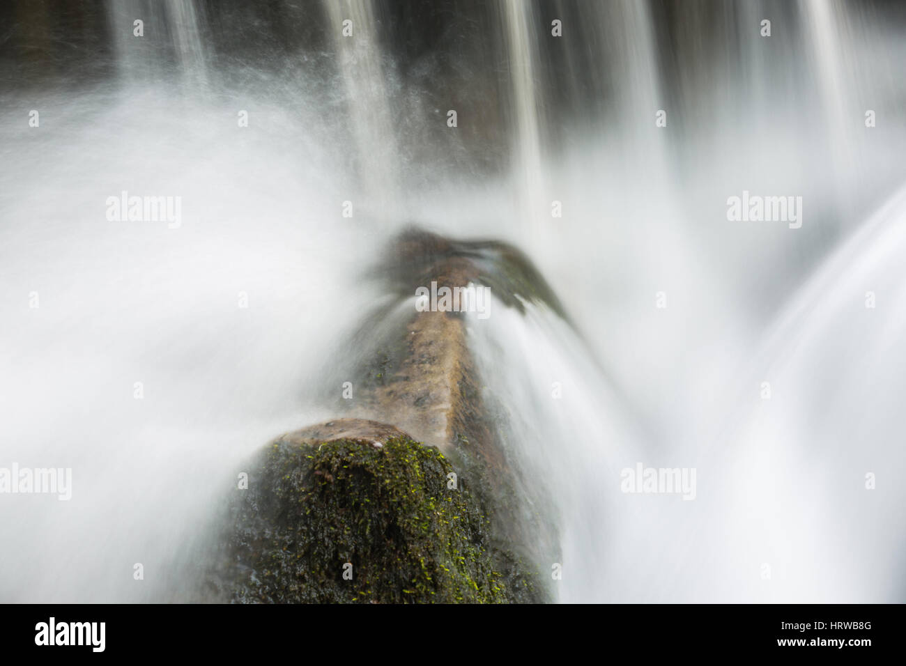 Beautiful splashes of water in a small waterfall Stock Photo - Alamy