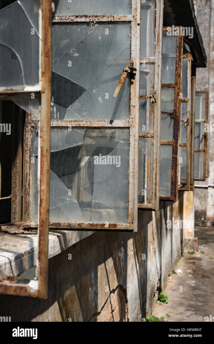 broken windows of an abandoned building Stock Photo - Alamy