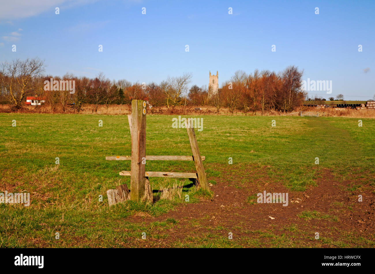 A view of a public footpath over farmland on the Norfolk Broads at ...