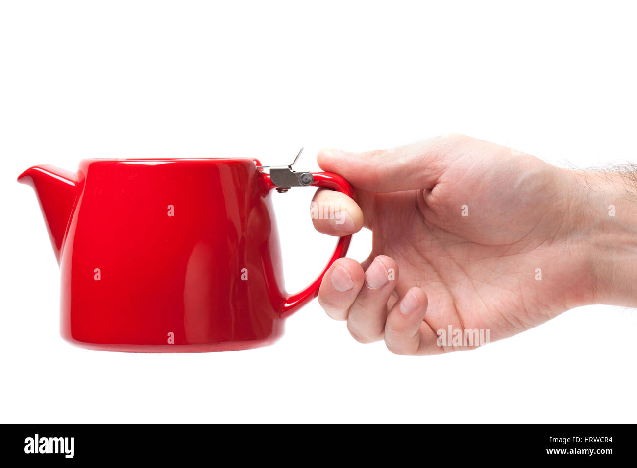 Man hand holding object Red teapot isolated on white background. High ...