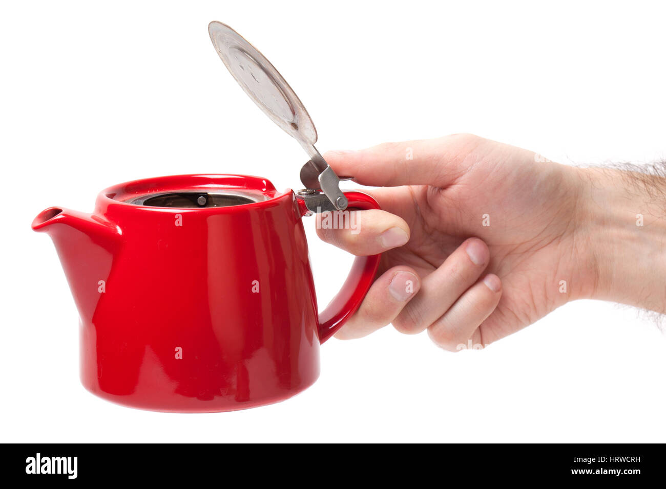 Man hand holding object Red teapot isolated on white background. High ...