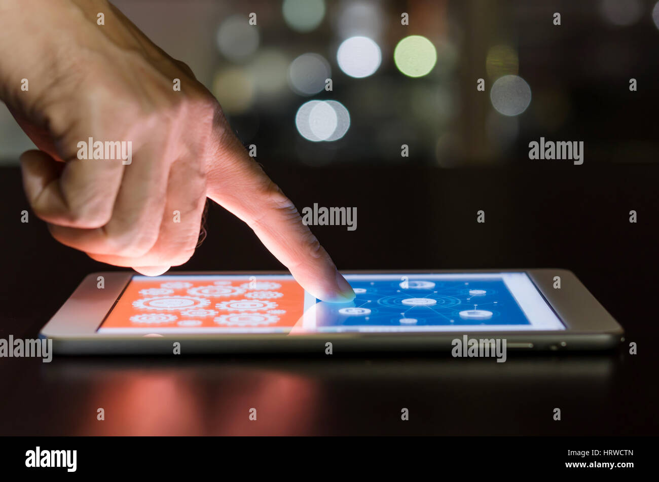 Closeup of finger touching screen on tablet with network connection ...