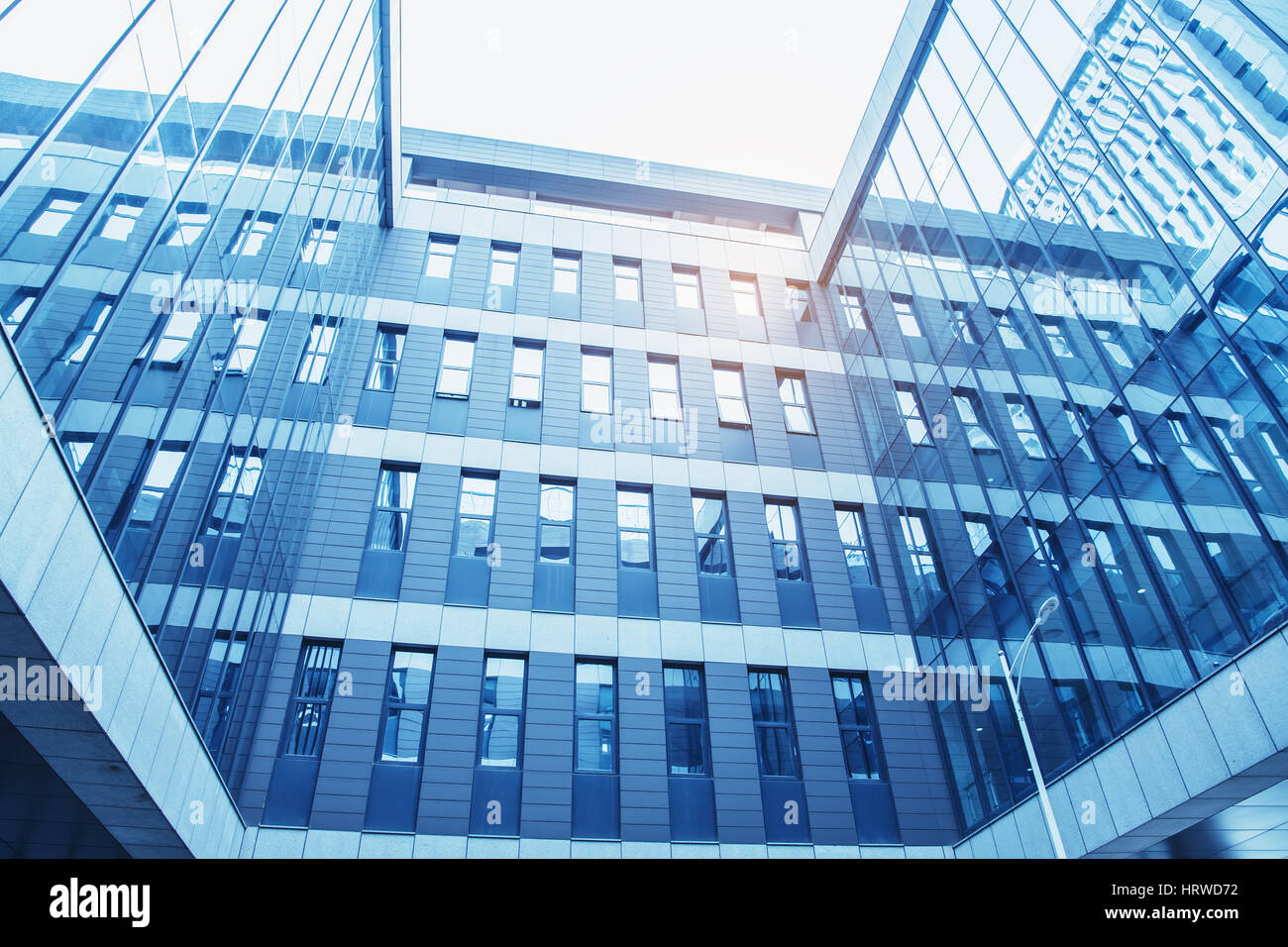 office building with blue glass wall detail Stock Photo - Alamy