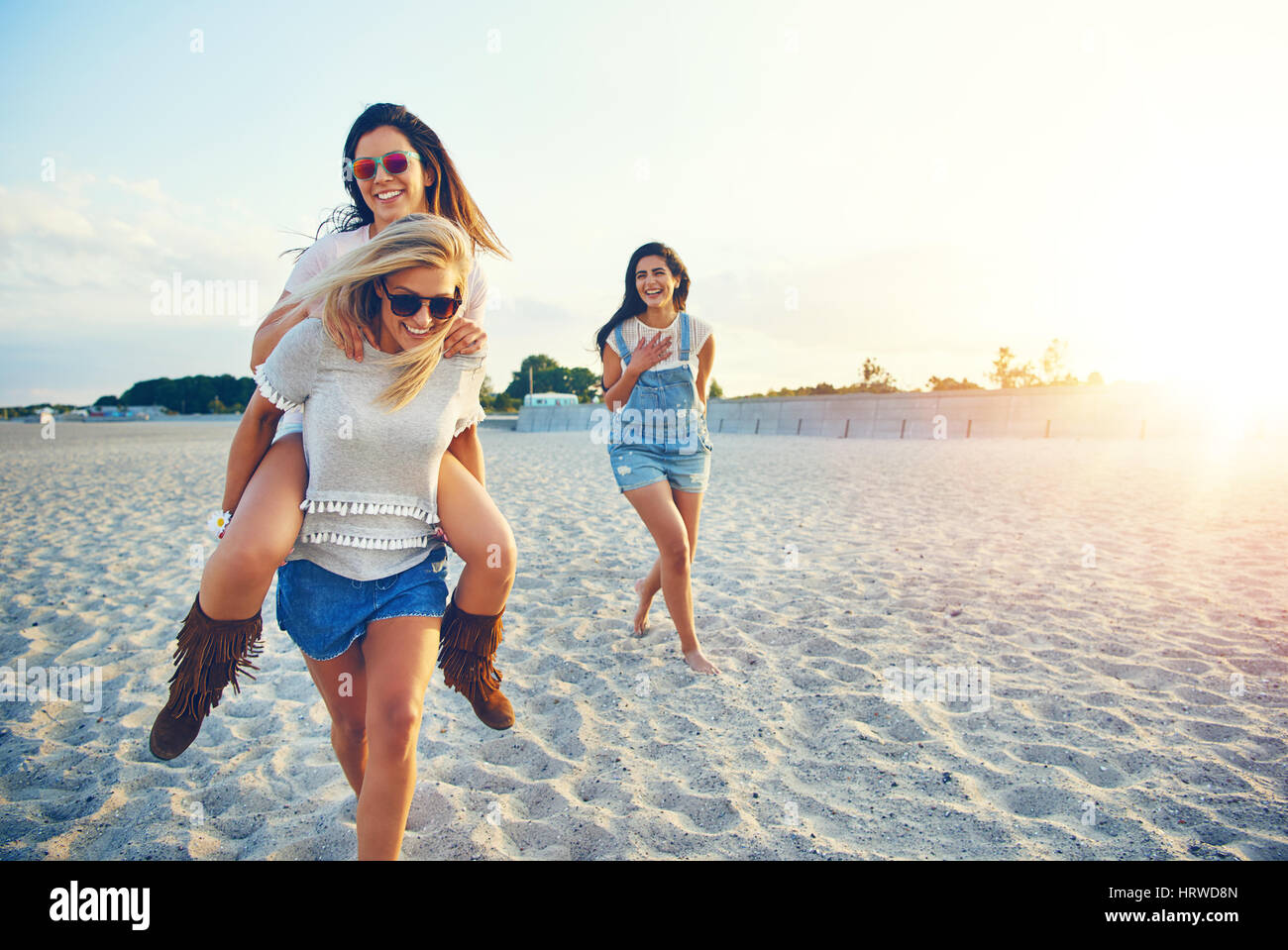 Friend giving piggyback ride hi-res stock photography and images - Alamy