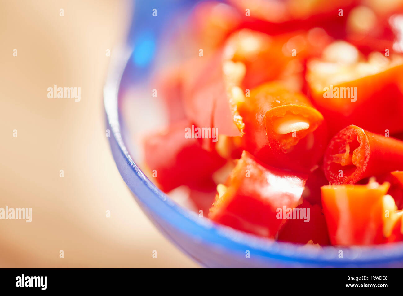 A tablespoon of chopped hot, red pepper pieces Stock Photo - Alamy