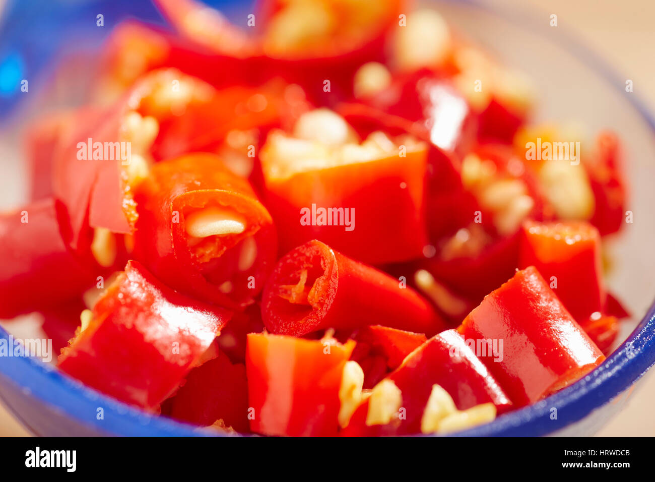 A tablespoon of chopped hot, red pepper pieces Stock Photo - Alamy