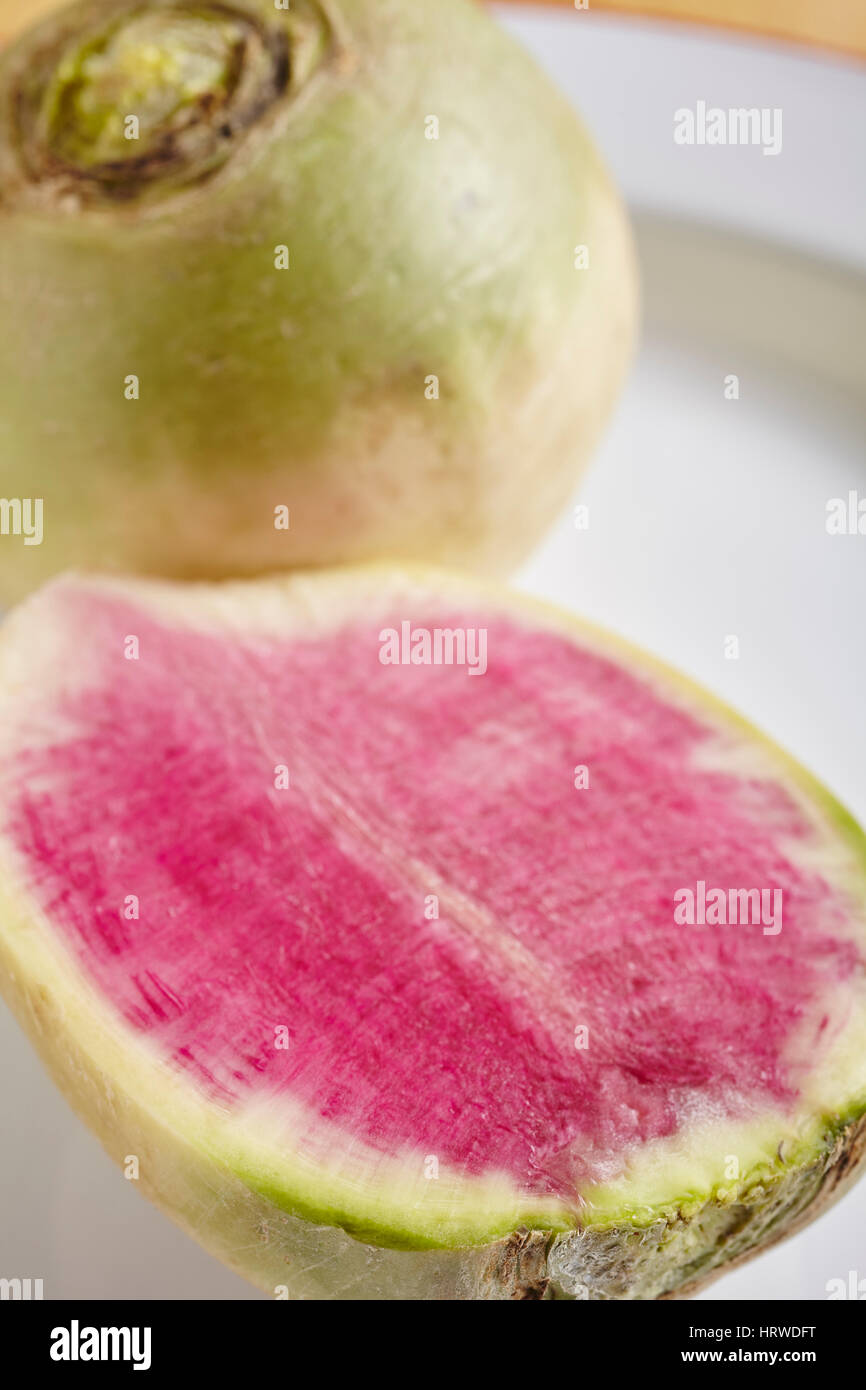 Watermelon Radishes. One is cut open to show how the inside is red ...