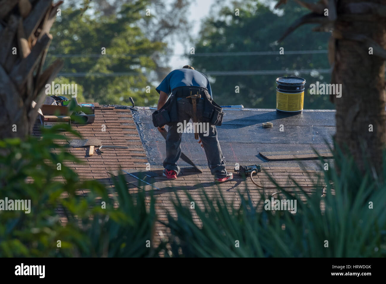 Worker fixing roof construction hi-res stock photography and images - Alamy