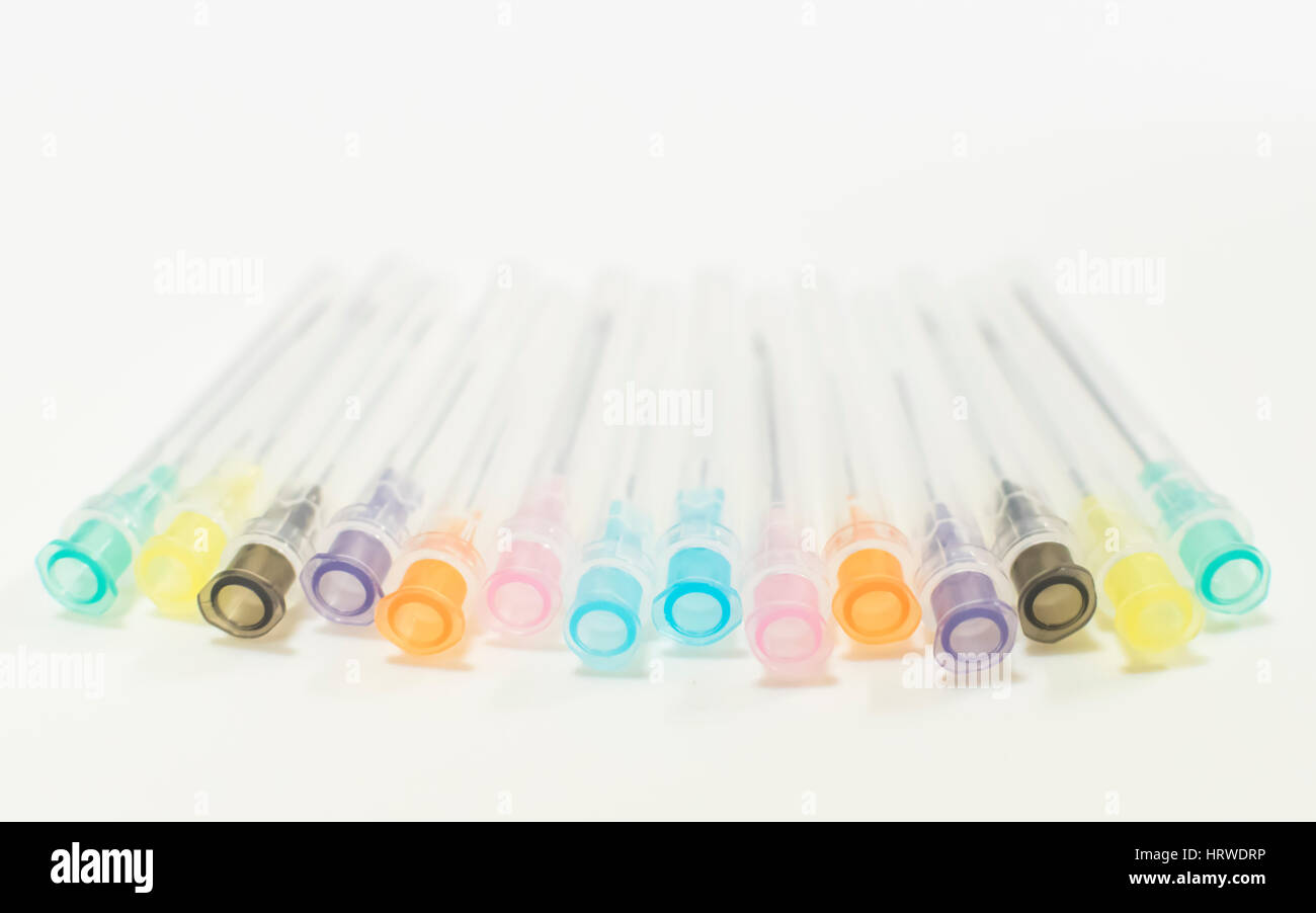 Colorful Needles put in needle sheath sort on white background Stock ...