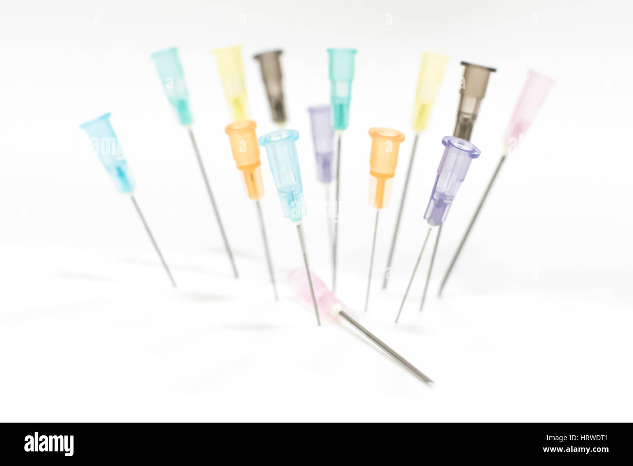Colorful Needles without needle sheath put on white board Stock Photo ...