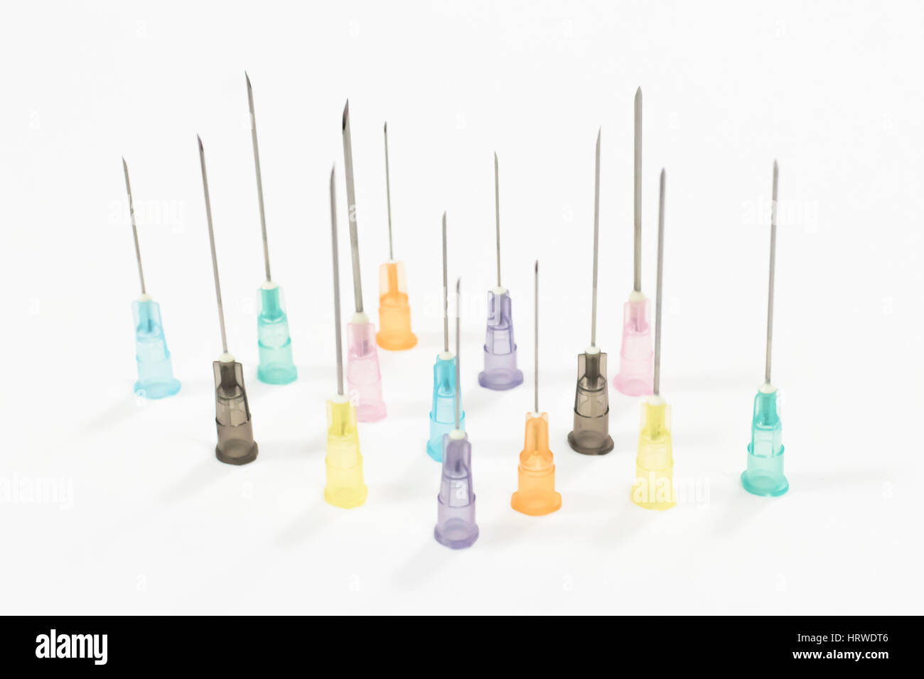 Colorful Needles put in needle sheath on white background Stock Photo ...