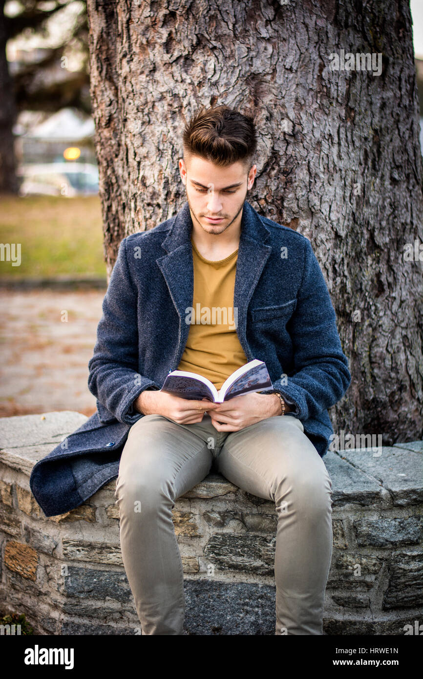Male student studying outside hi-res stock photography and images - Alamy